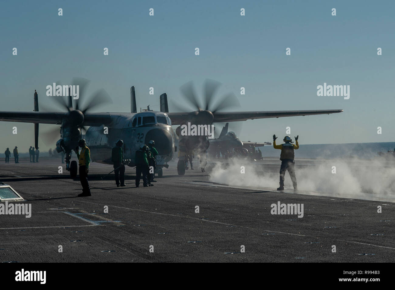 U.S. Sailors direct a C-2A Greyhound, assigned to Fleet Logistics ...