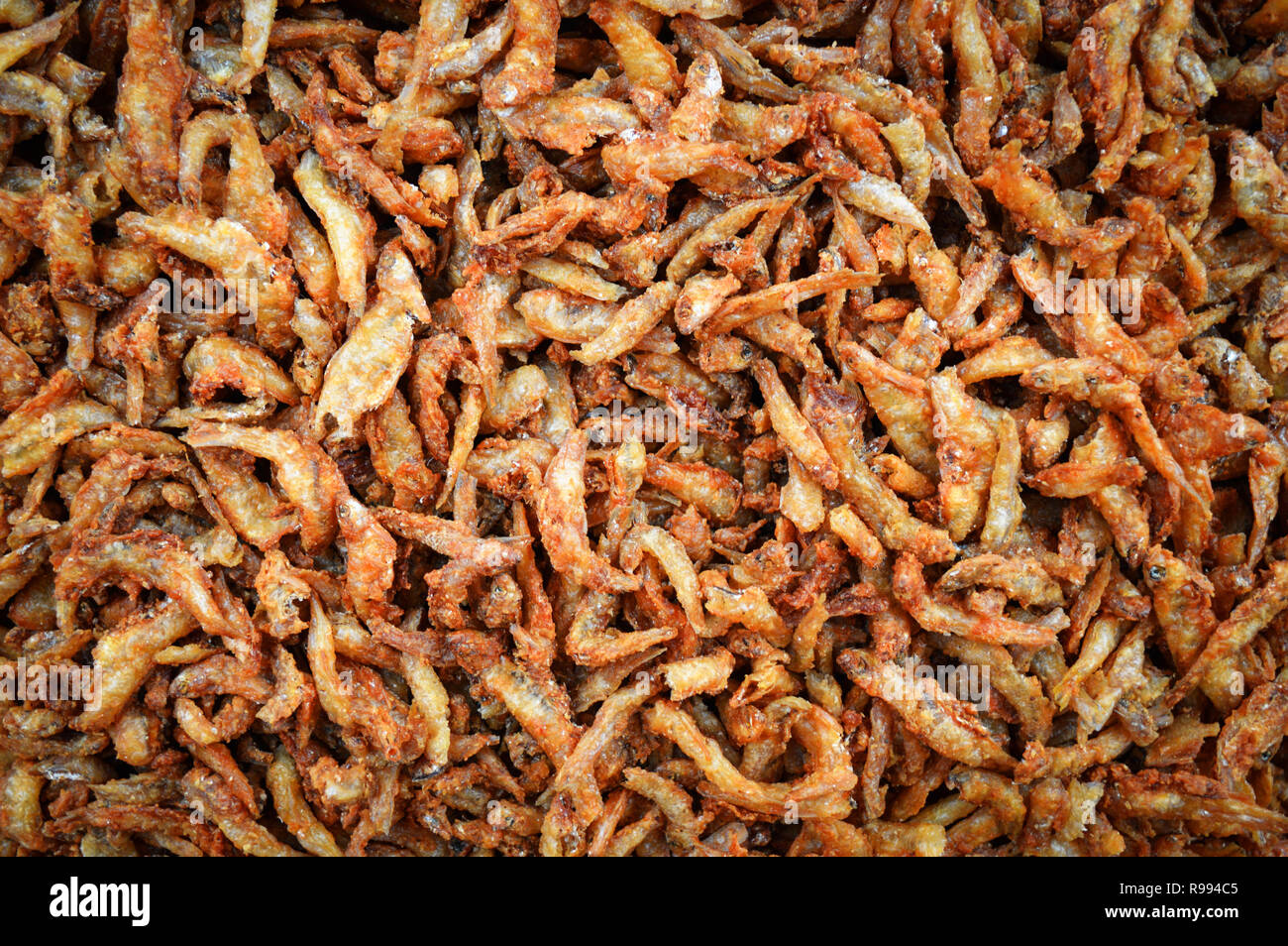 Small fried fish crispy / Pile of deep fried small fishes snack texture ...