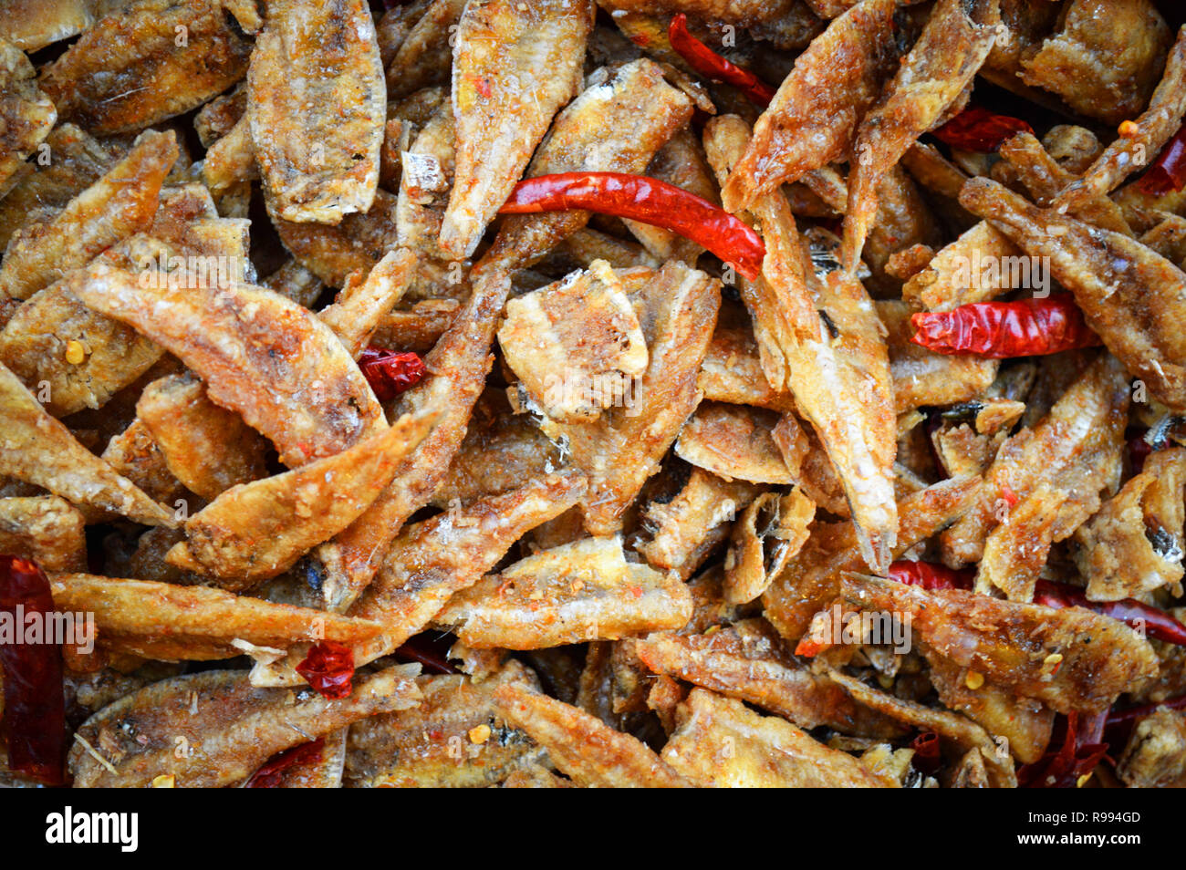 Small Fried Fish Crispy with dried chilli / Pile of deep fried small ...