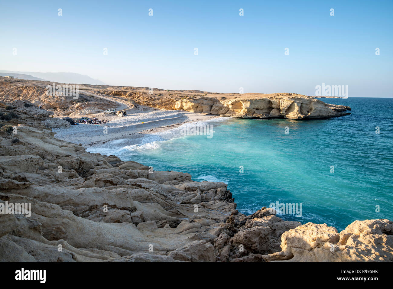 Poeple camping on a beach in the wild coast of the Sultanate of Oman ...