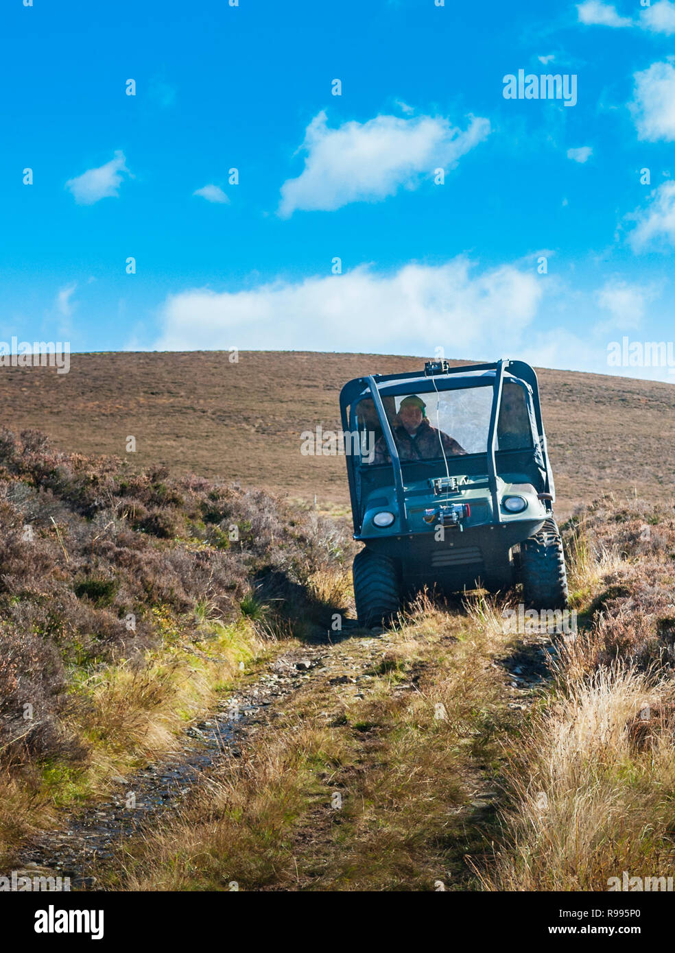 An Argocat multi-wheel all-terrain vehicle working high in The Scottish ...