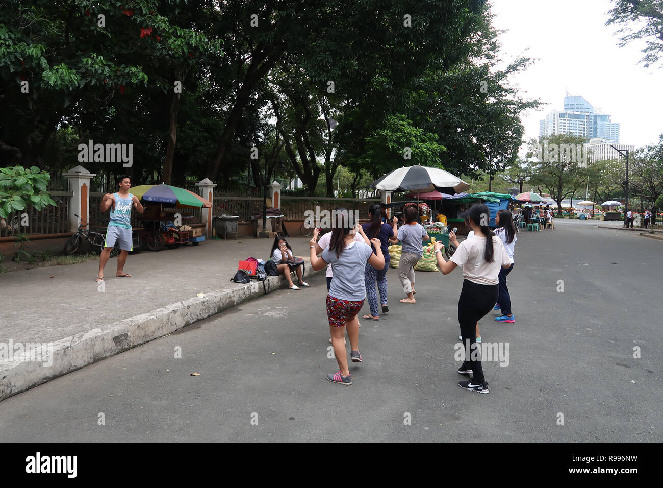 A group of young Filipinos teenagers training to perform flash mob in ...