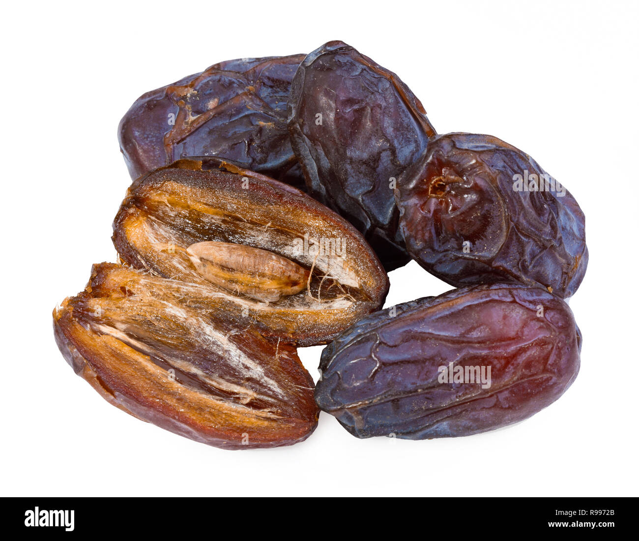 big ripe date - a piece cut in half sultanas, the core in the middle ...