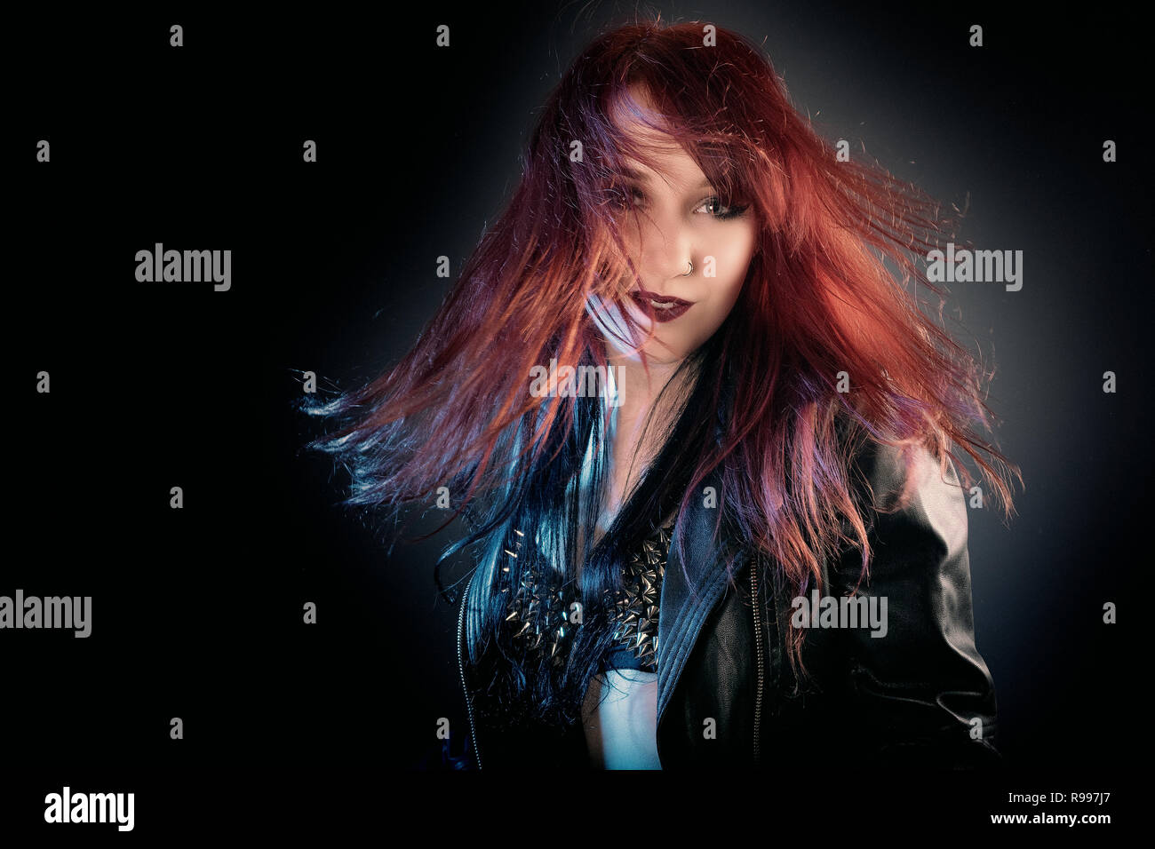 Studio portrait of a young redhead dancing Stock Photo - Alamy