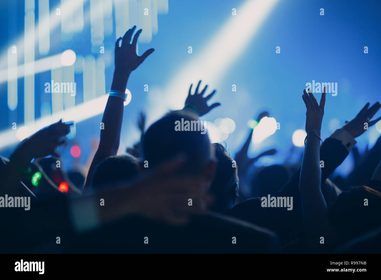 Concert, event or party concept. People with hands up at the scene ...