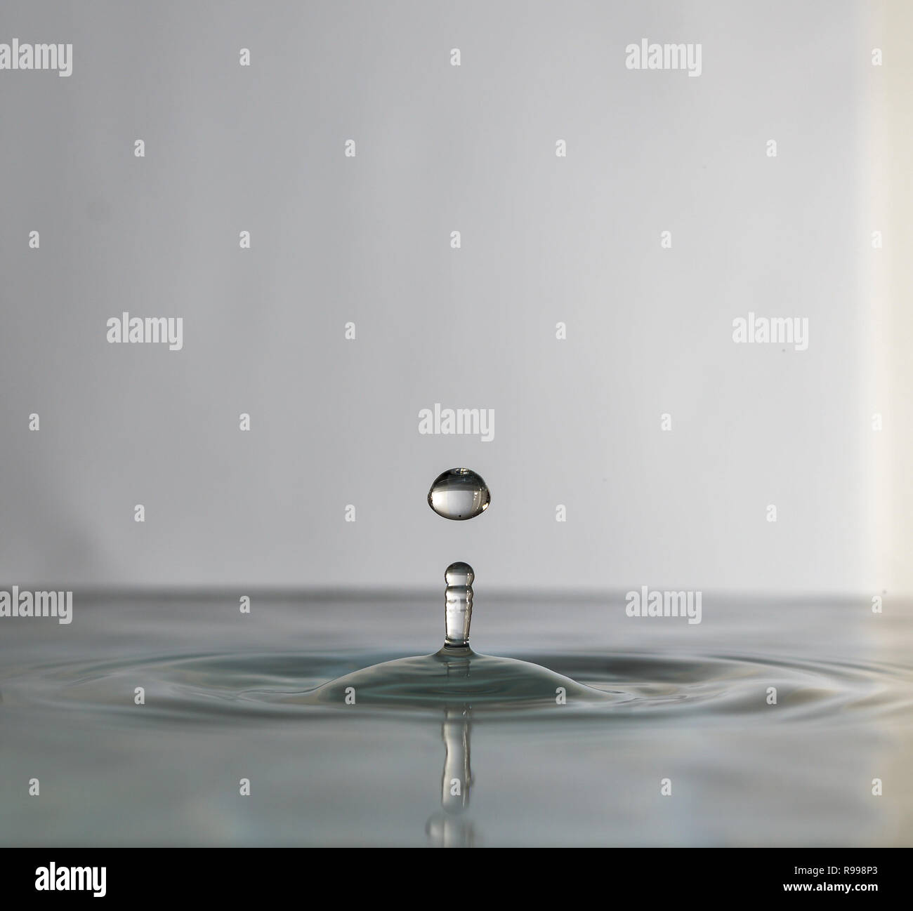 Droplets Hitting Water Surface Stock Photo - Alamy