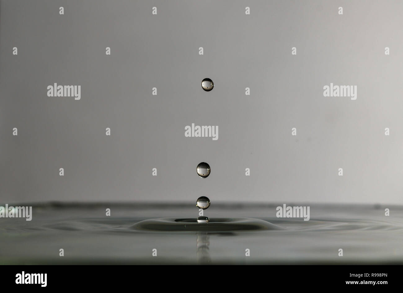 Droplets Hitting Water Surface Stock Photo - Alamy