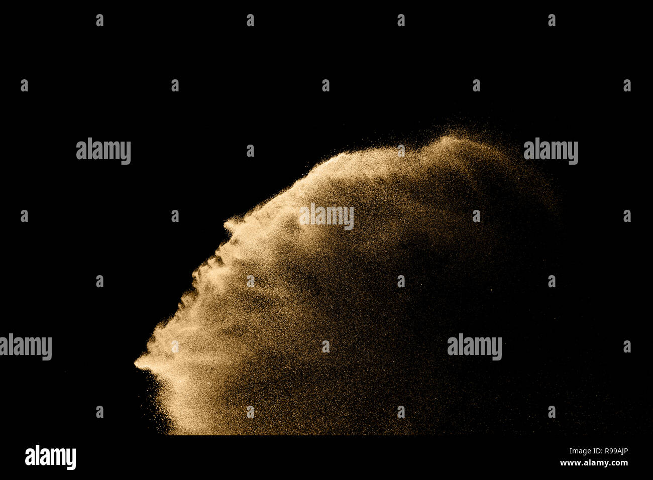 Dry river sand explosion. Golden color sand splash against black ...