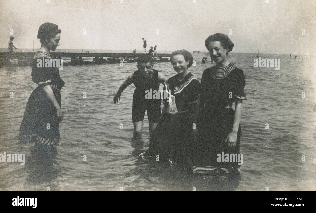 Antique 1908 photograph, fashionable swimmers in the ocean. Location ...