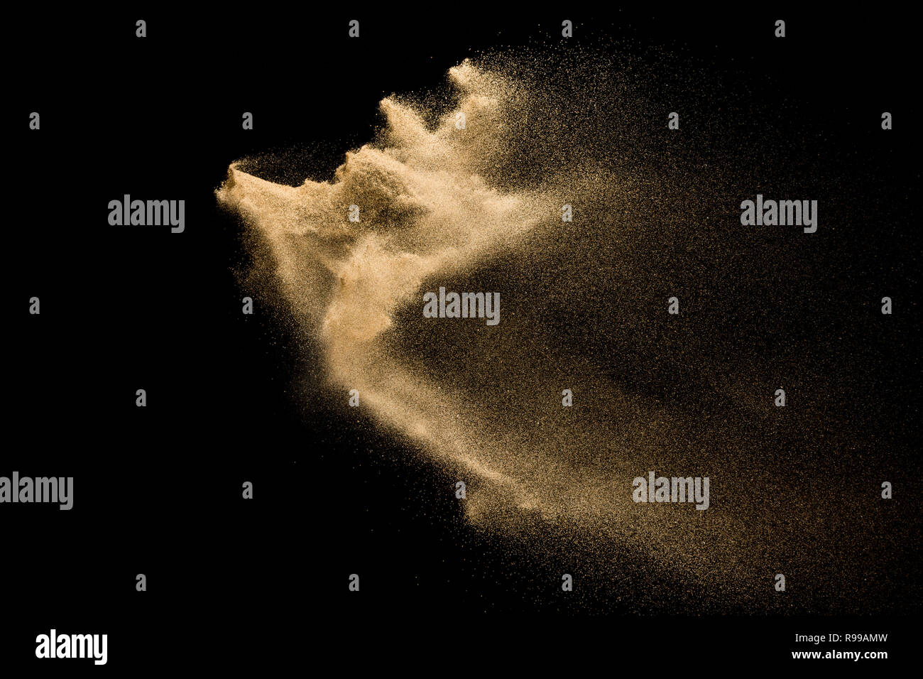 Dry river sand explosion. Golden color sand splash against black ...
