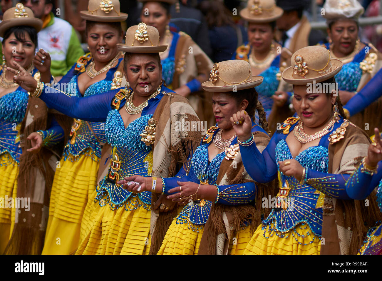 Morenada dancers in ornate costumes parade through the mining city of ...