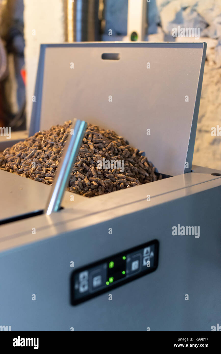 Heating boiler uses pellets as fuel. Pile pellets in the heater Stock ...
