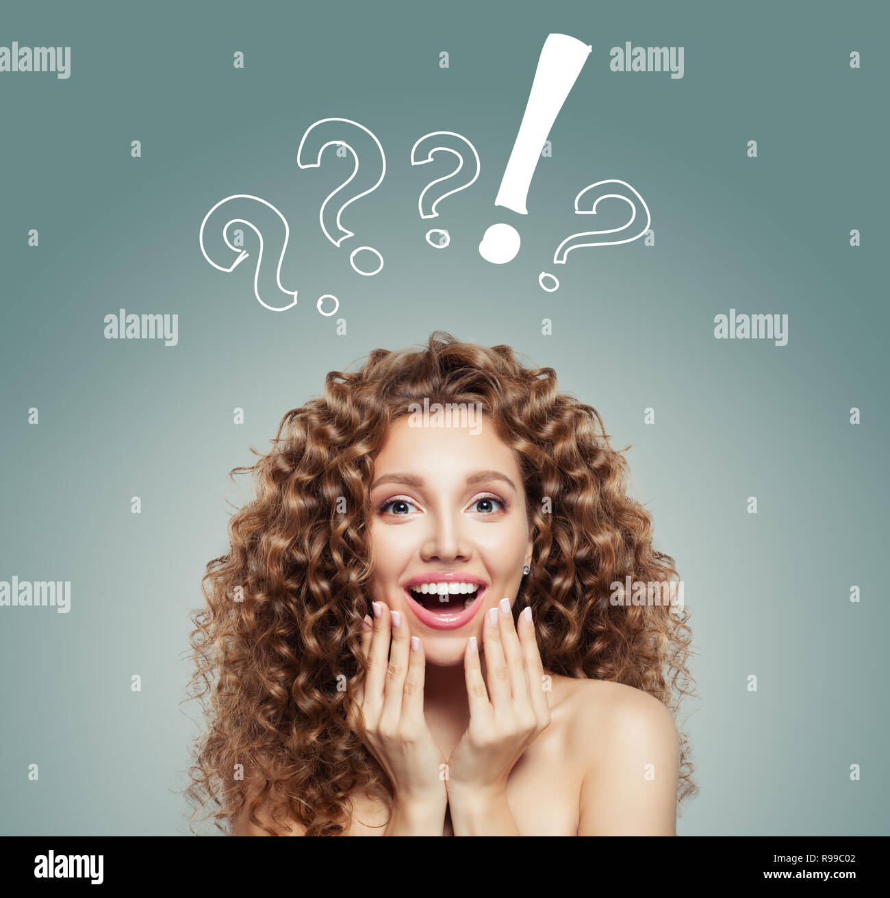 Happy surprised woman. Beautiful girl with long curly hair. Presenting ...