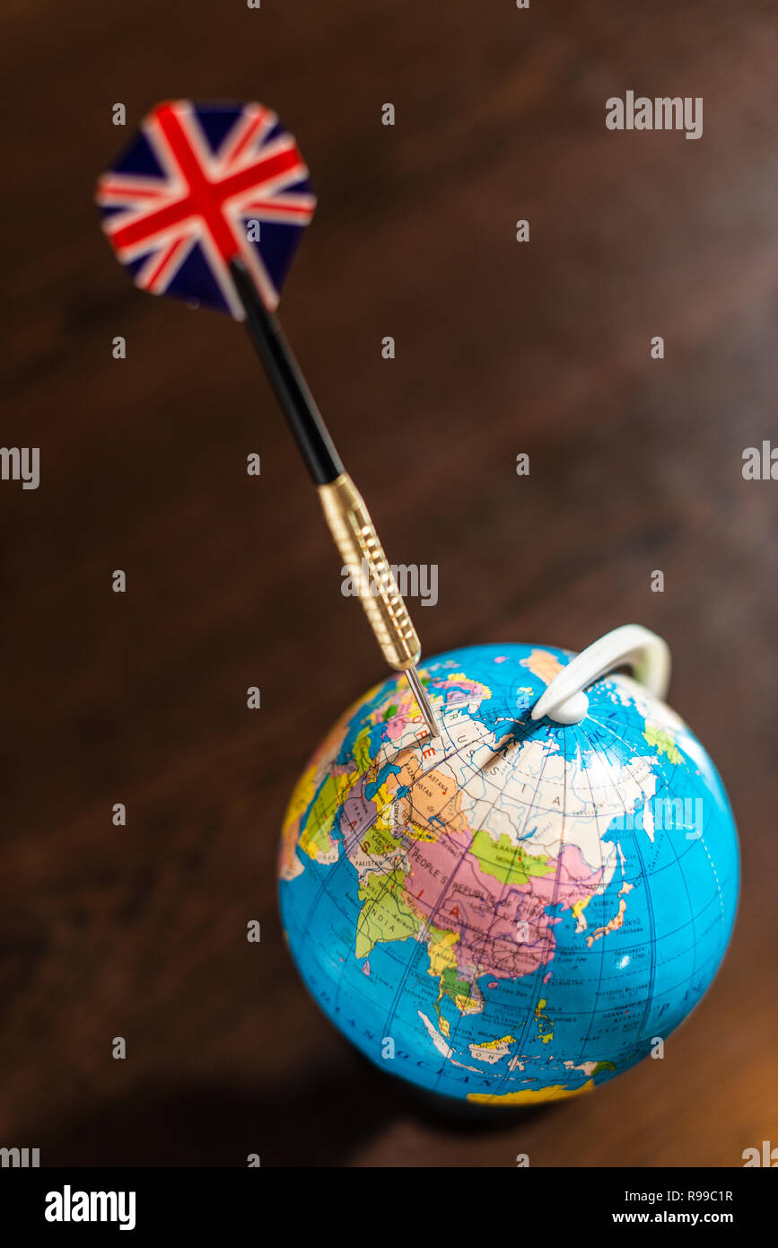 UK concept targeting Russia. Darts arrow pricked on Russia on globe ...