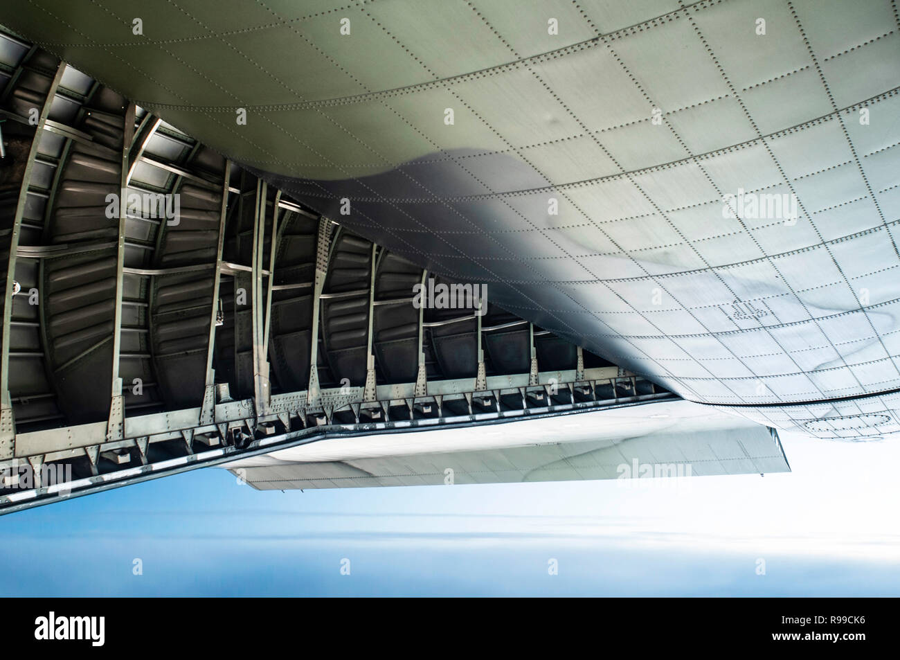Interior of military plane. Opened door during the fly. Military ...