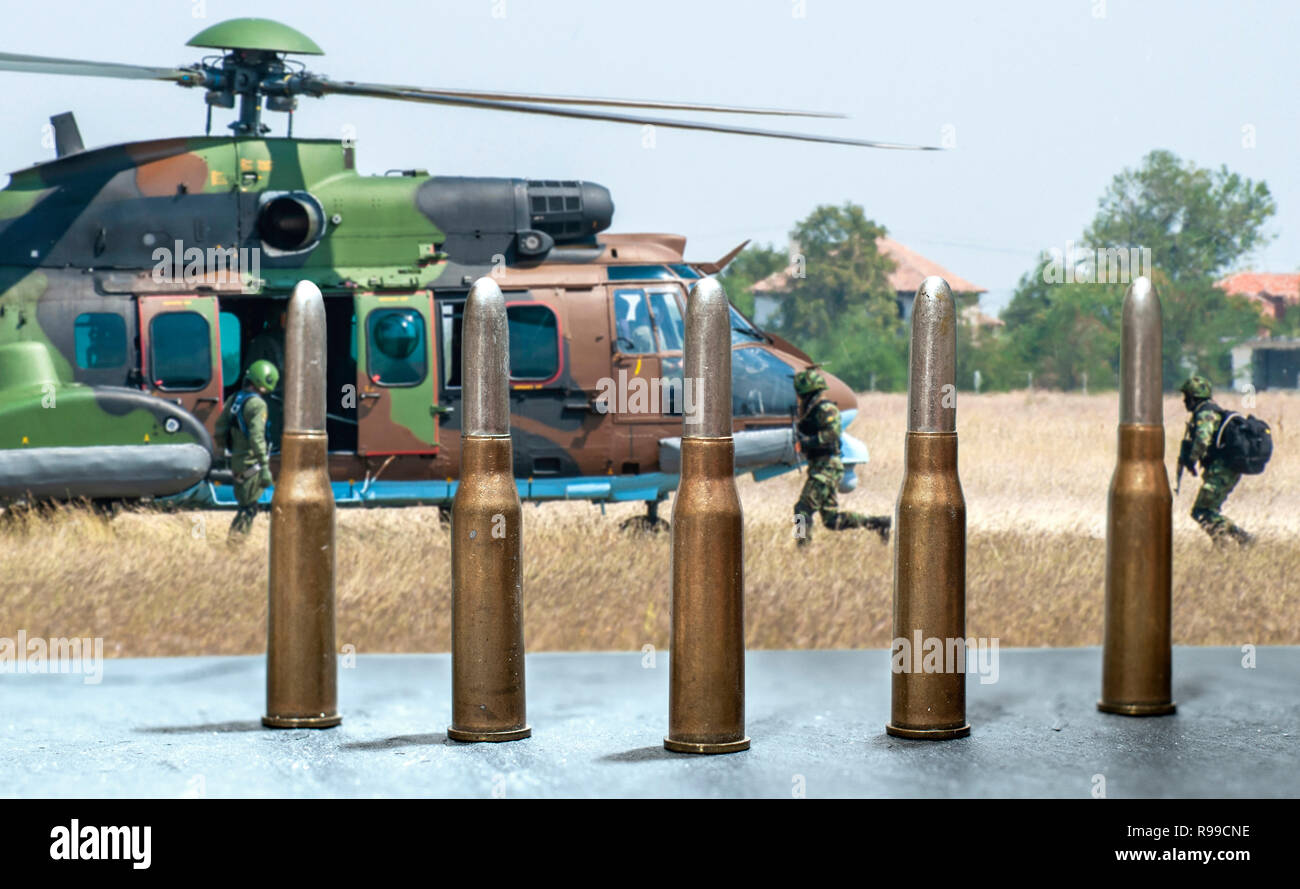 Soldiers on a rescue military operation with helicopter. War and ...