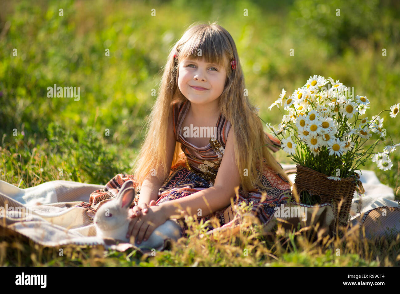 Cute farmer beautiful girl in jeans enjoying summer day in village life ...