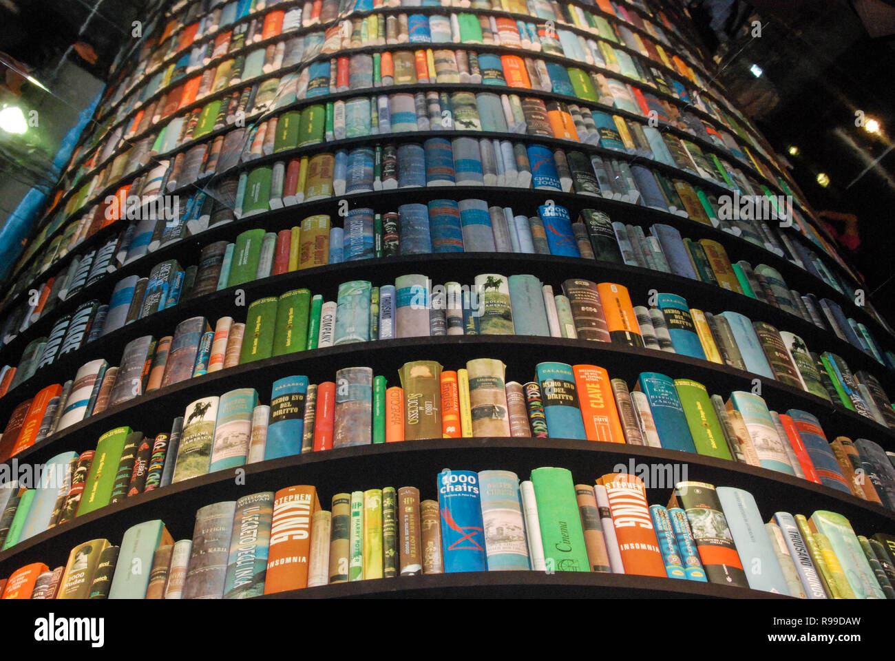 Books in a tower-shaped bookcase Stock Photo - Alamy