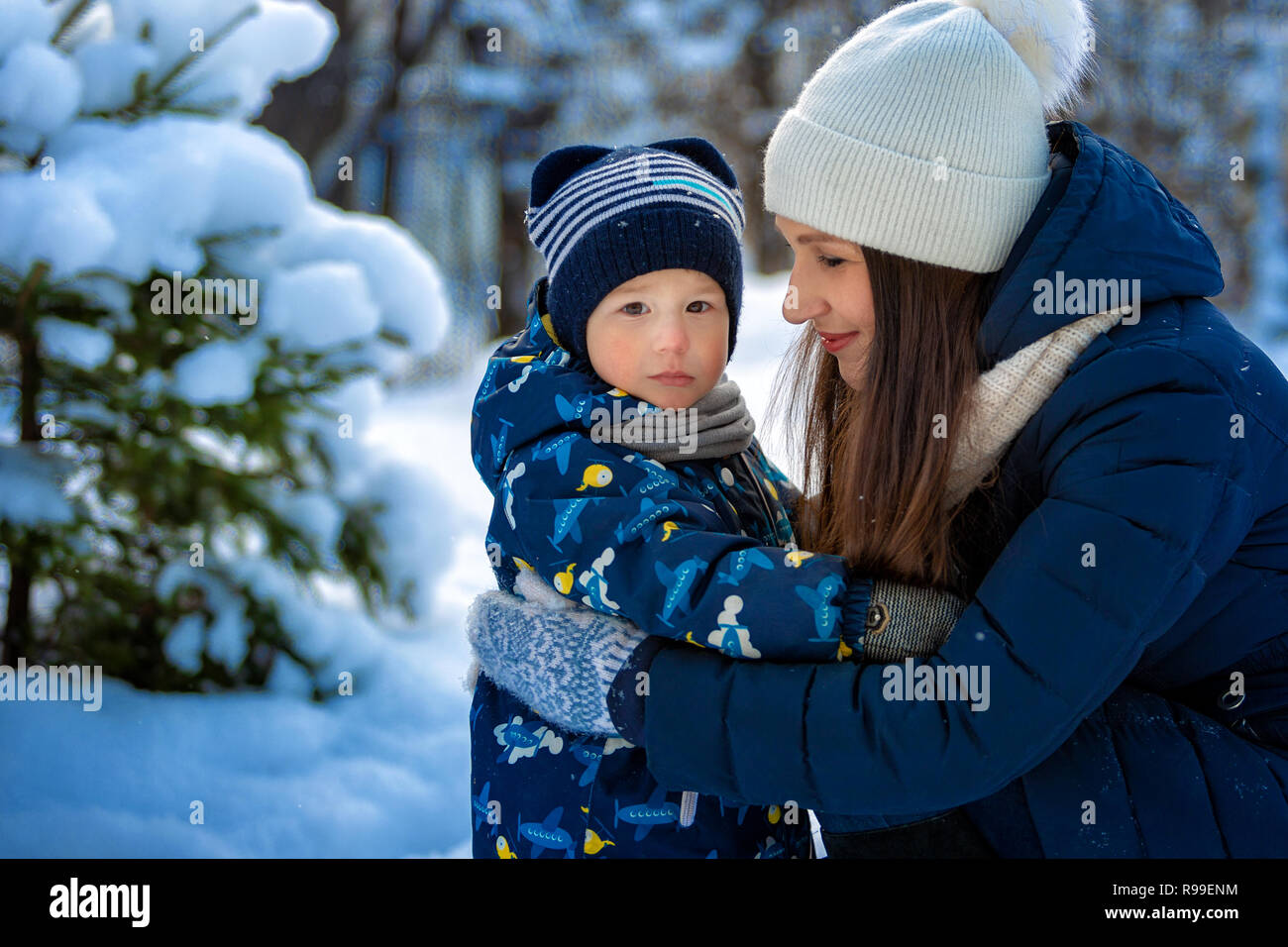 Woman and child in winter in nature. Portrait of a happy family Stock ...