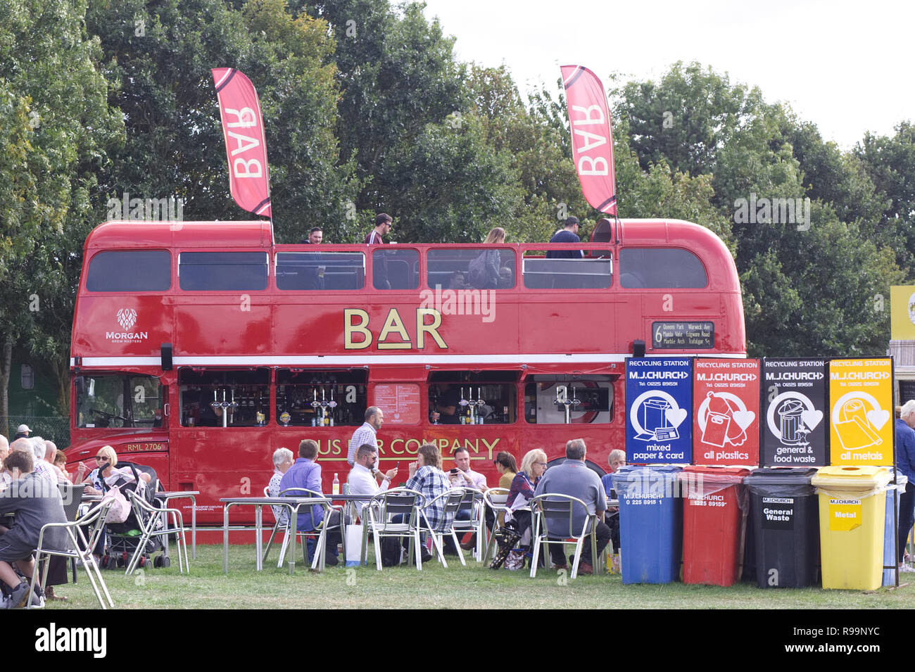 Bus company bar and recycling bins on a showground Stock Photo - Alamy