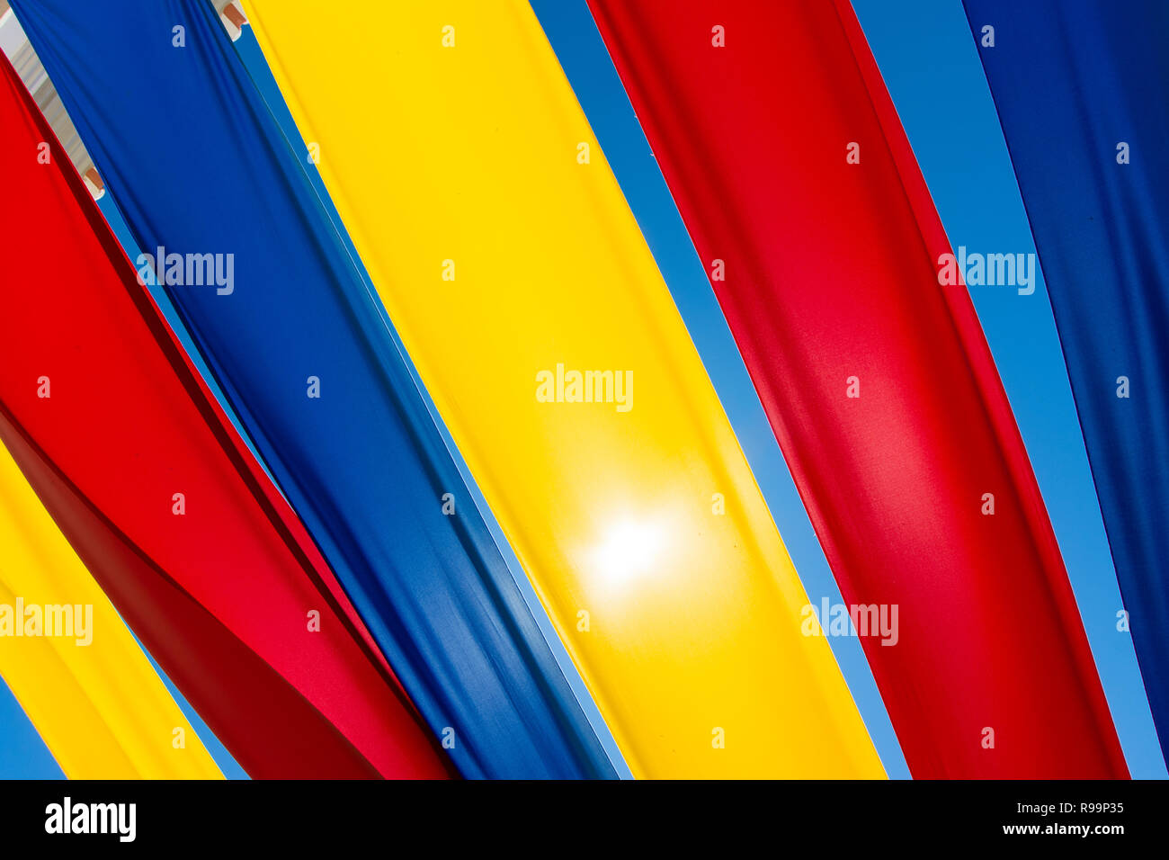 Colorful awning for shadow under sun. Summer background Stock Photo - Alamy