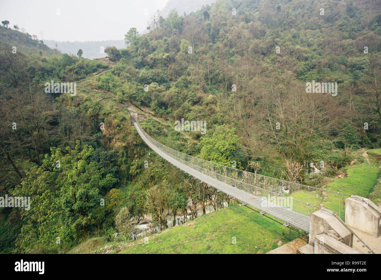 Suspension bridge in Himalayas Stock Photo - Alamy