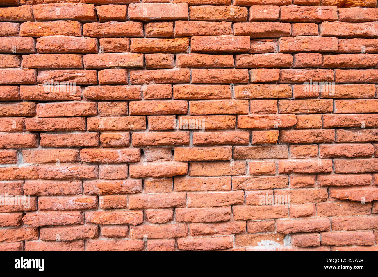 detail of distressed, weathered and spalling red brick wall Stock Photo ...
