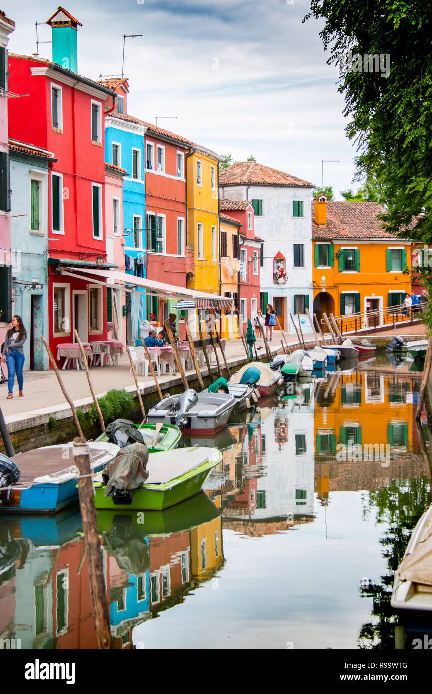 perspective view of row of colourful houses in Burano Venice Italy ...