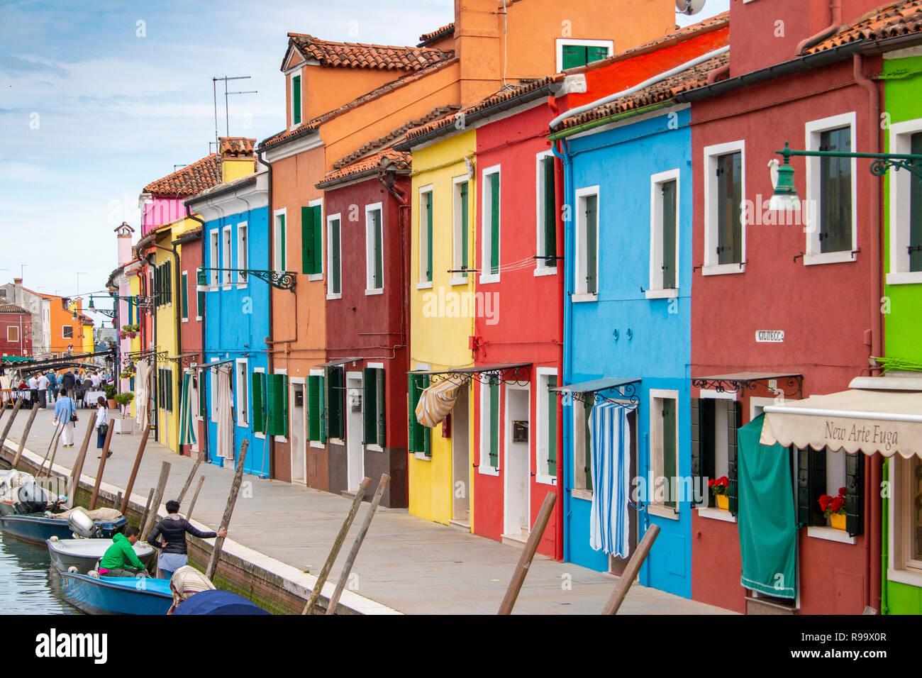 perspective view of row of colourful houses in Burano Venice Italy ...