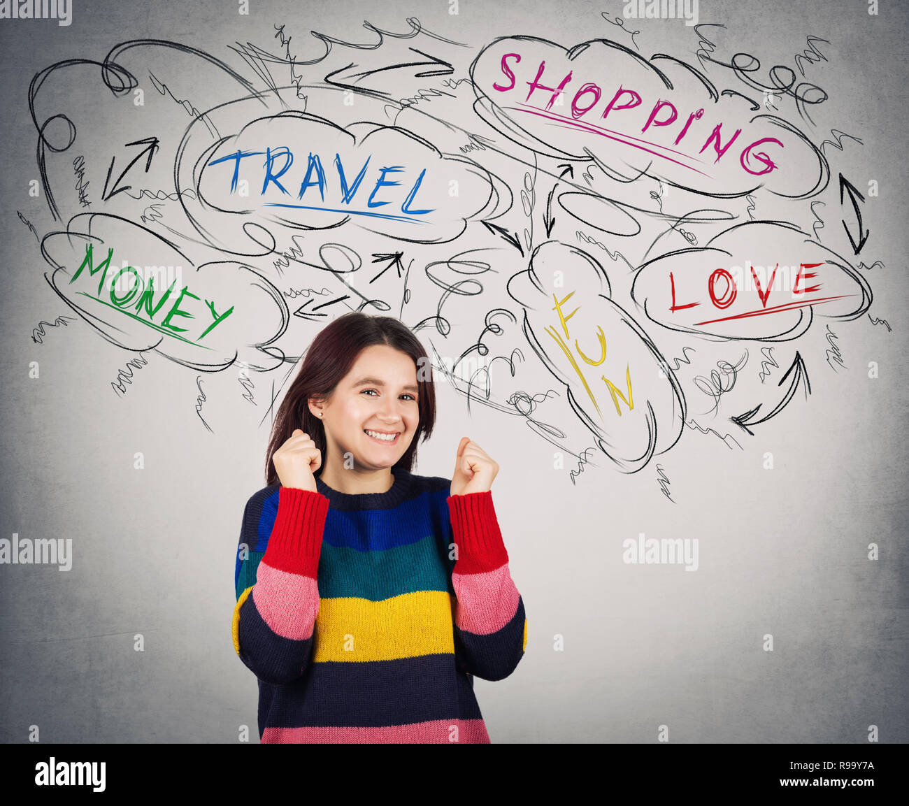 Cheerful excited young student woman looking to camera and smiling ...