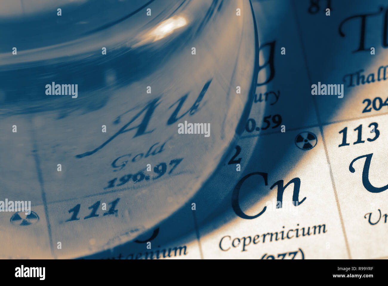 Chemicals in glass laboratory flask on the periodic table chart with ...