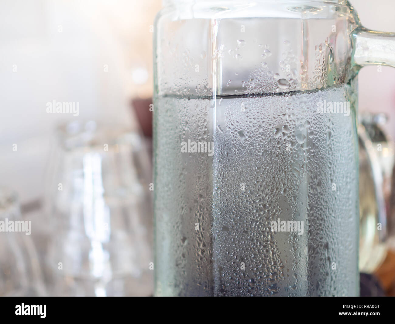 Close-up cold water in glass pitcher with copy space Stock Photo - Alamy