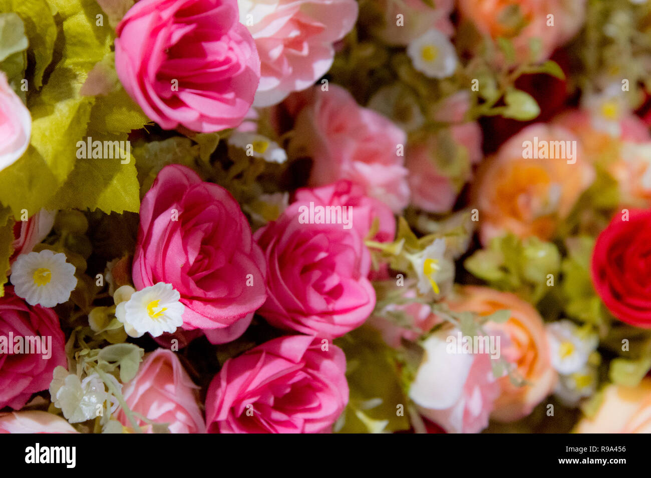 Plastic Roses Flowers Background Stock Photo - Alamy