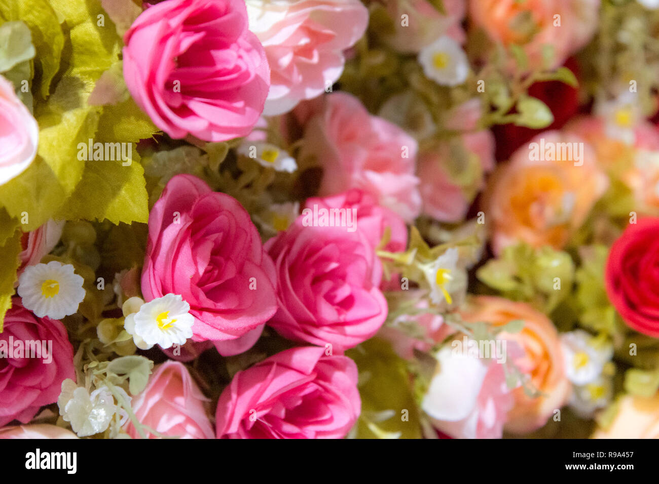 Plastic Roses Flowers Background Stock Photo - Alamy