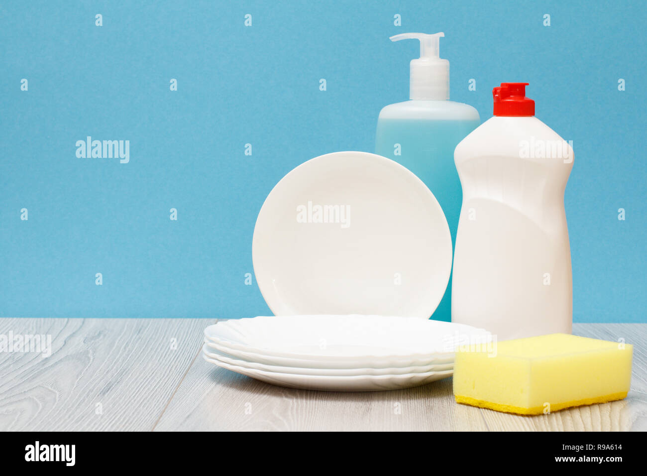 Plastic bottles of dishwashing liquid, glass and tile cleaner, clean ...