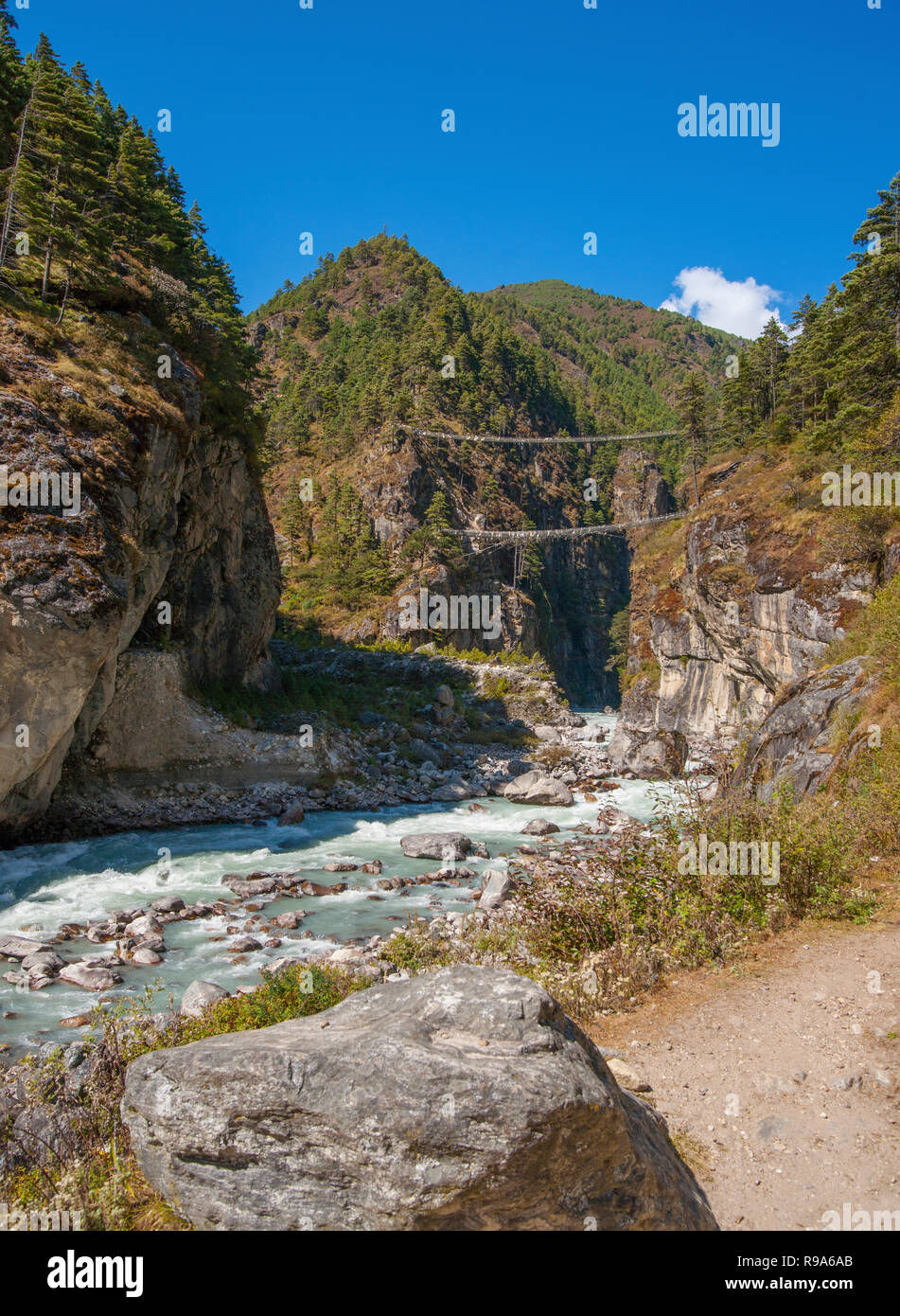 Suspension bridge on the way to Namche Bazar in Himalayas. Everest base ...