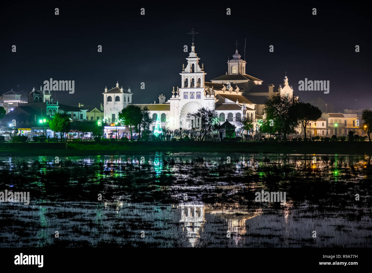 El Rocio church and town reflected at night Stock Photo - Alamy
