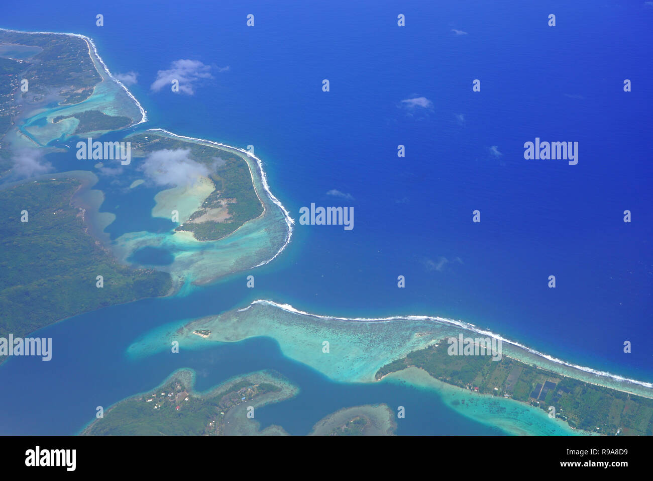Aerial view of the island and lagoon of Huahine near Tahiti in French ...
