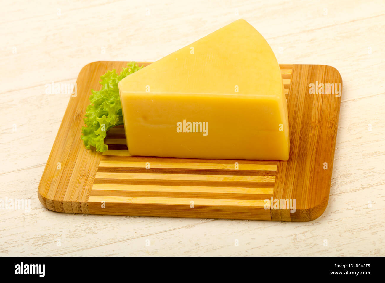 Parmesan cheese triangle Stock Photo - Alamy