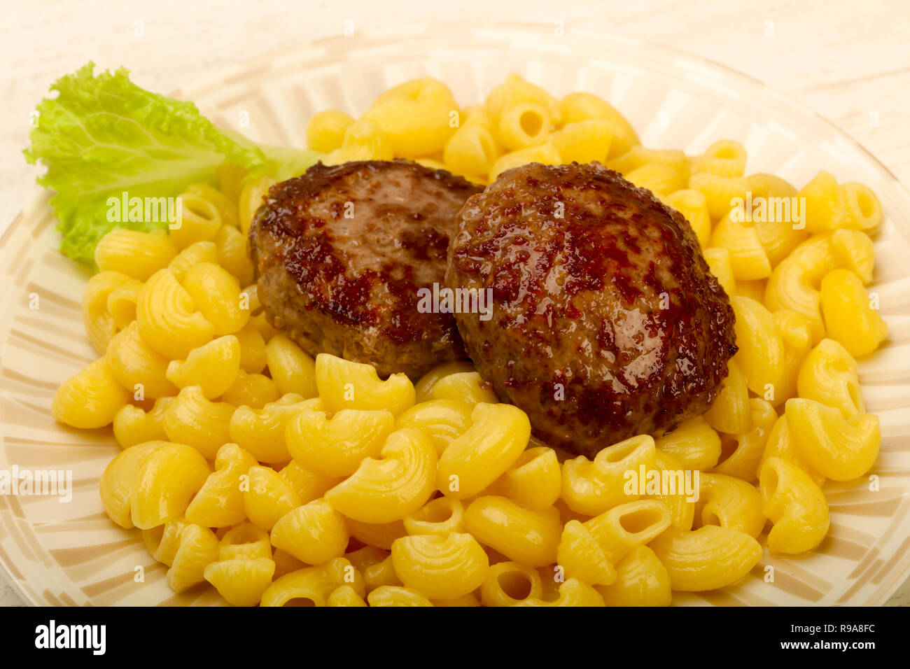 Macaroni Pasta with cutlet Stock Photo - Alamy