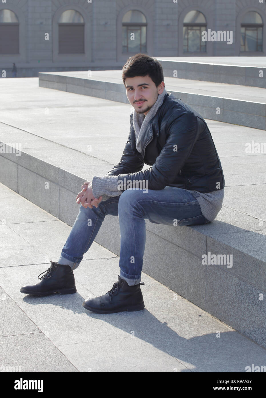 Male executive sitting on steps hi-res stock photography and images - Alamy