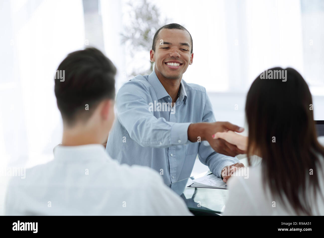 closeup.handshake Manager and the client in the office Stock Photo - Alamy