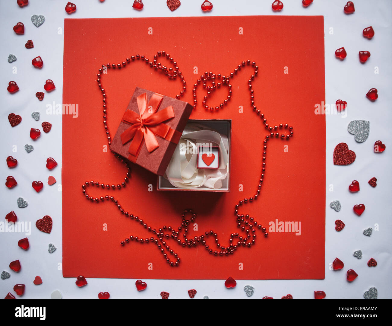 Red box and inside it is another small box with a heart. Concept for ...