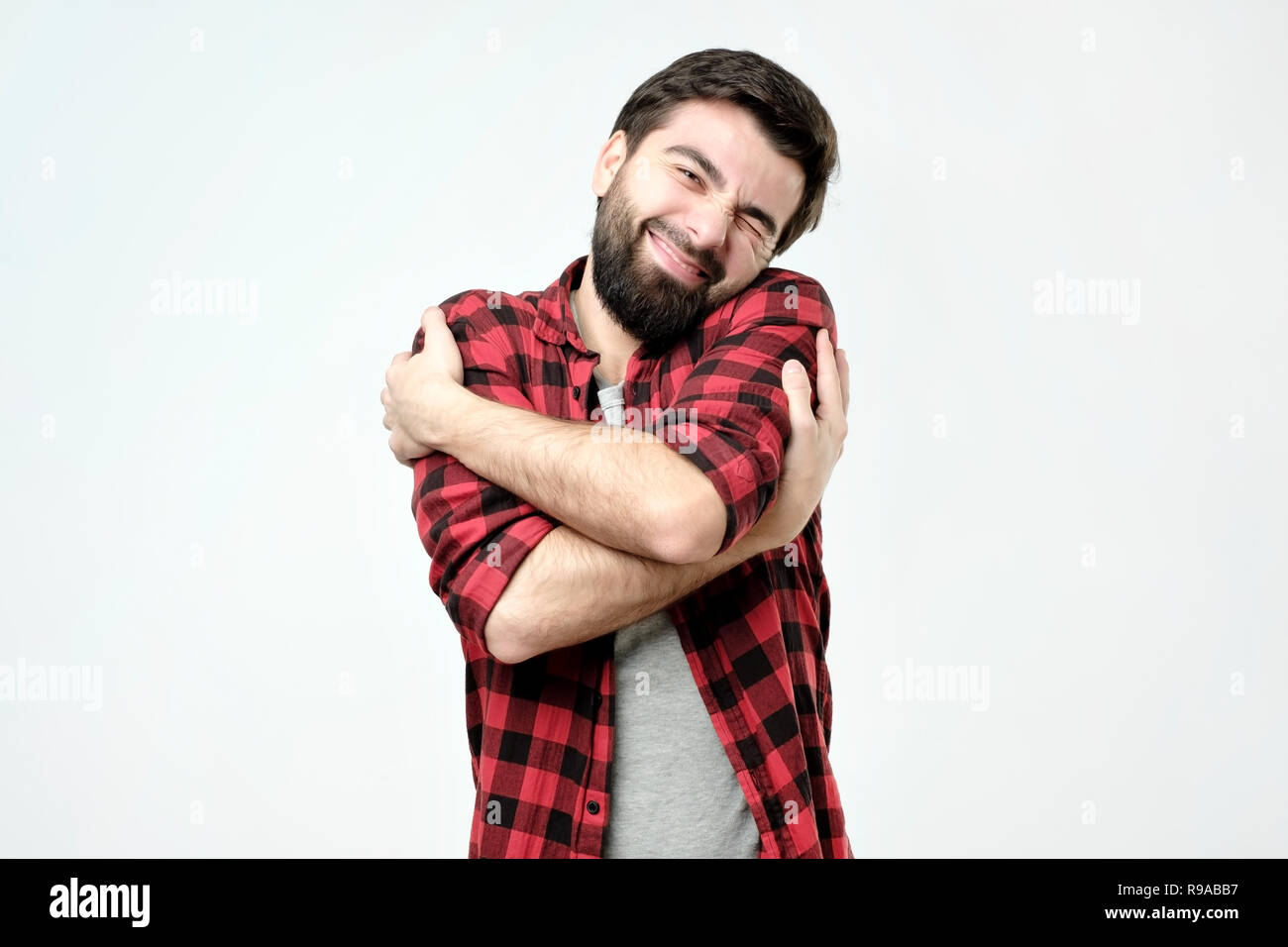 portrait confident smiling man hugging himself. I am the best concept ...