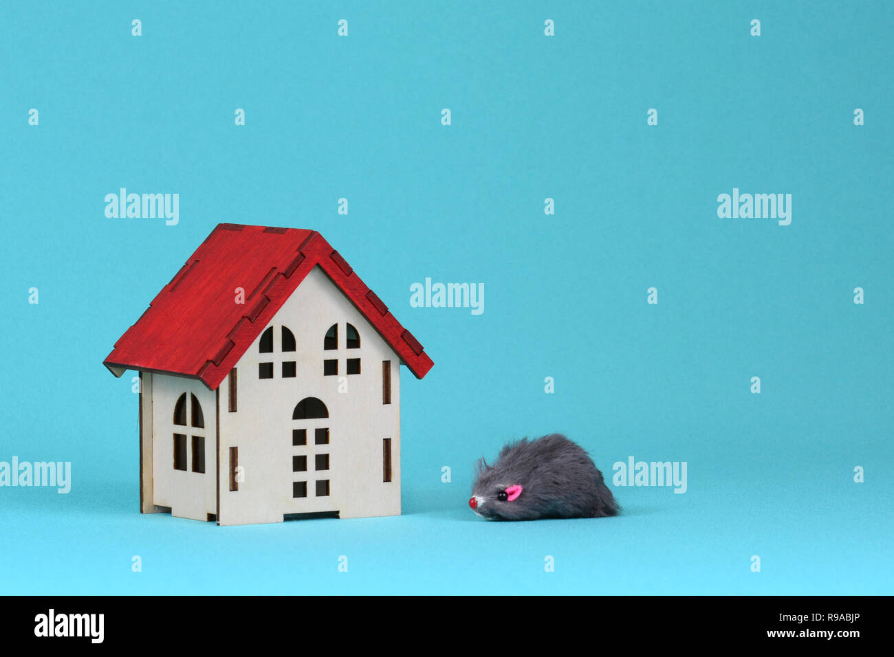 Mouse house. Cute small wooden house with red roof and toy house on ...