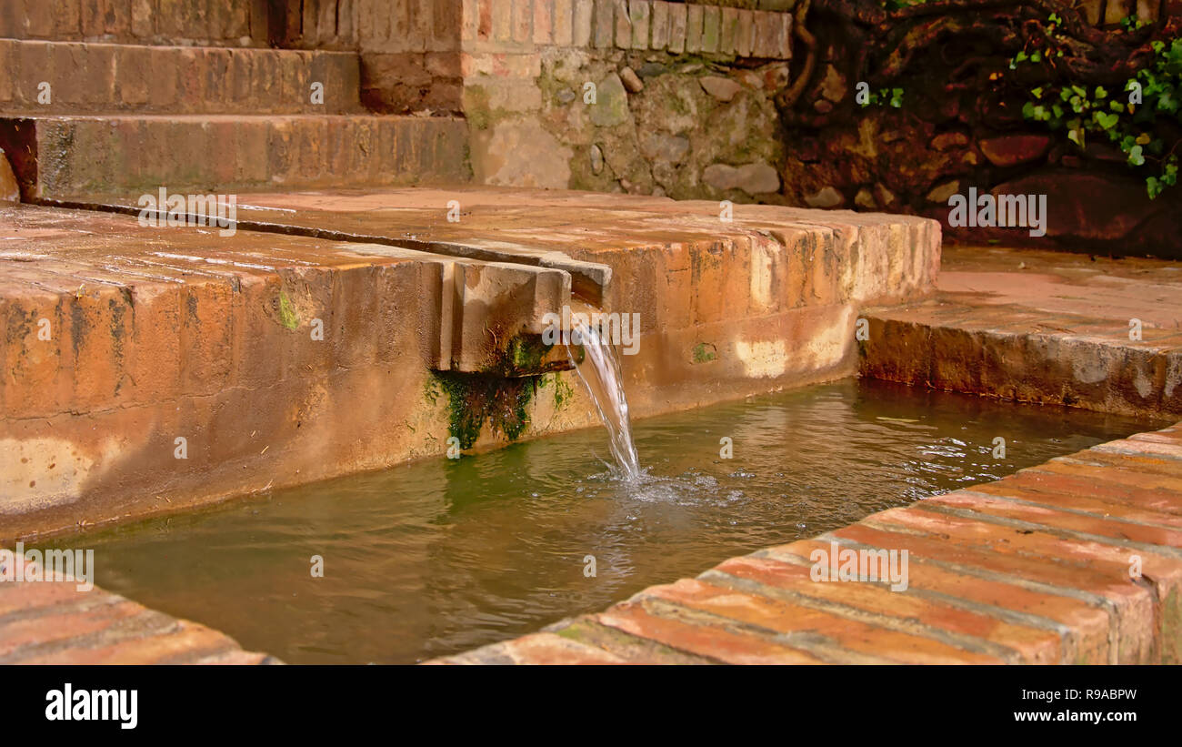 Water channel and basin, detail of Alhambra medieval moorish palace ...