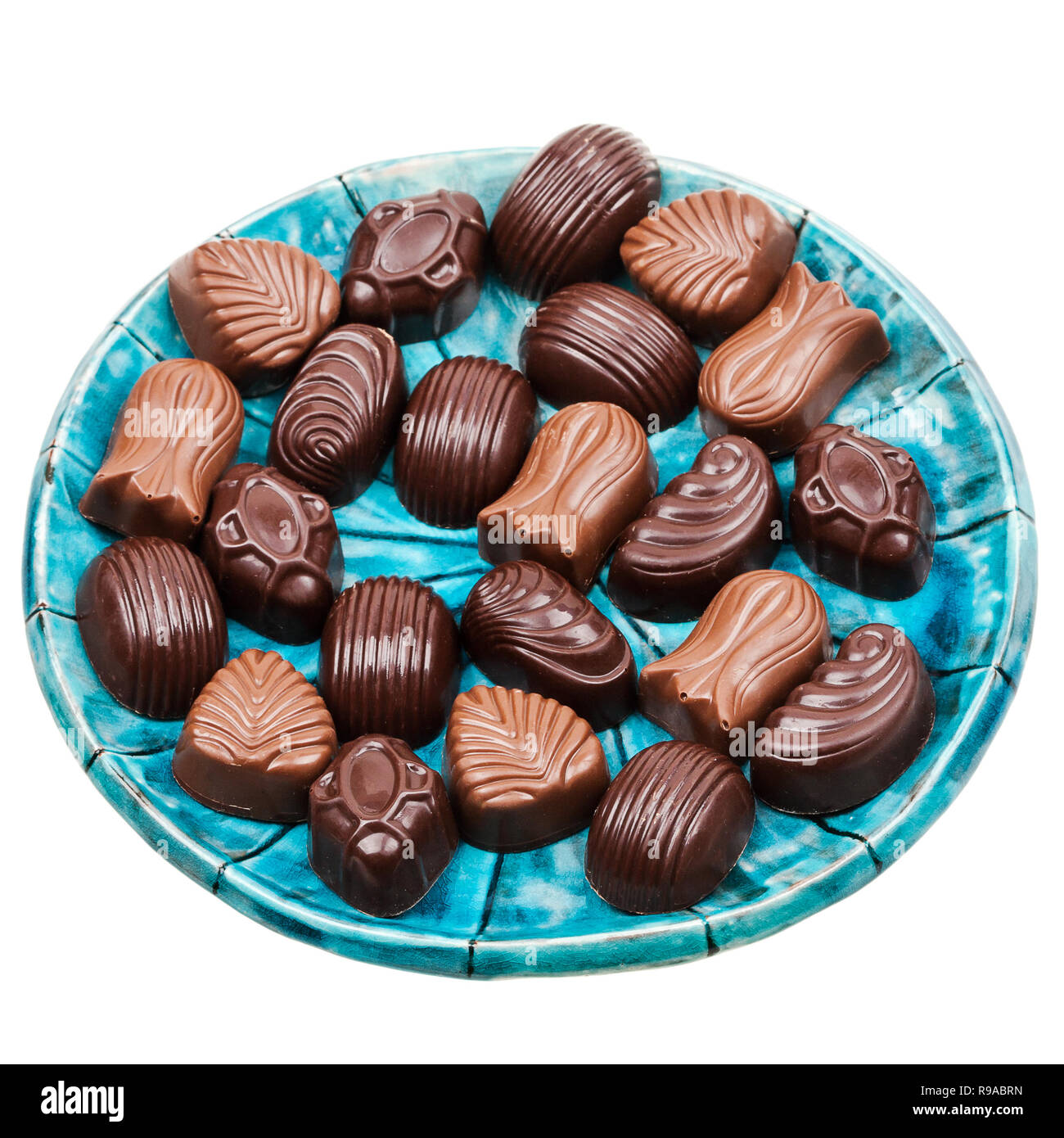 Plate of chocolates isolated on white background Stock Photo - Alamy