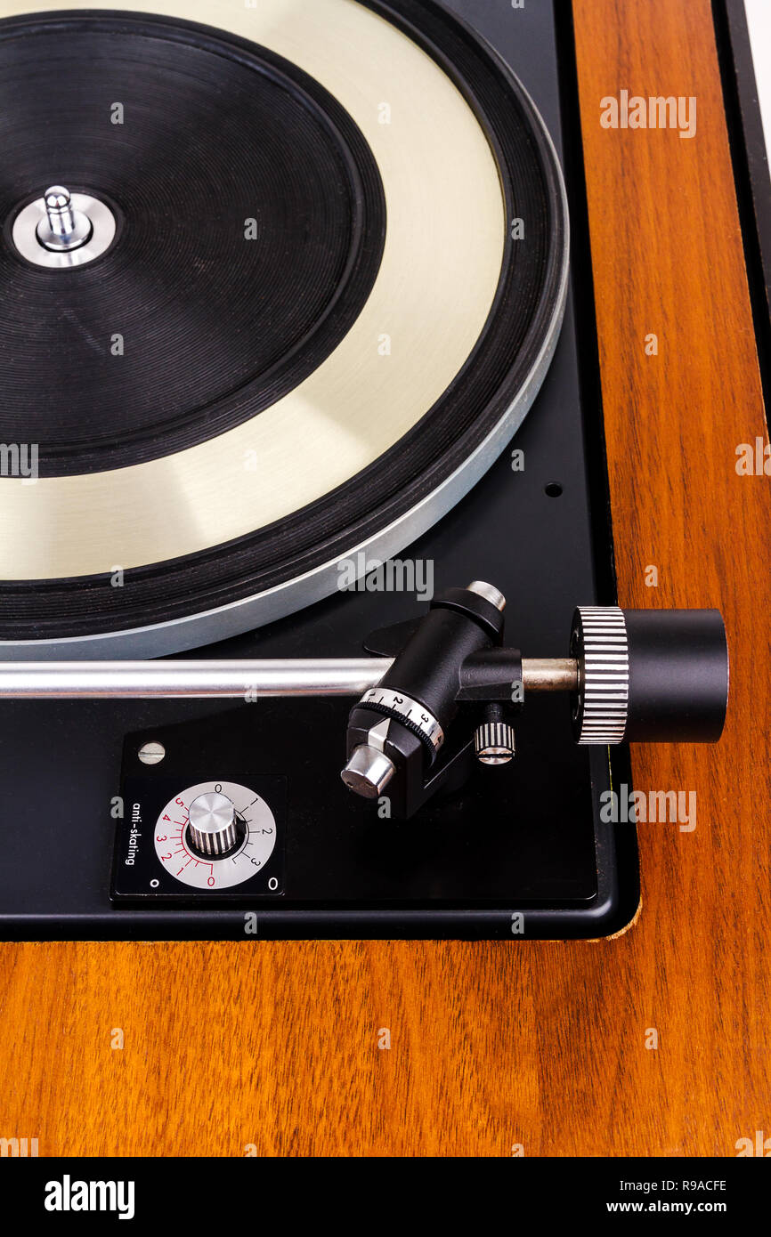 Close up of vintage turntable vinyl record player. Wooden plinth. Retro ...