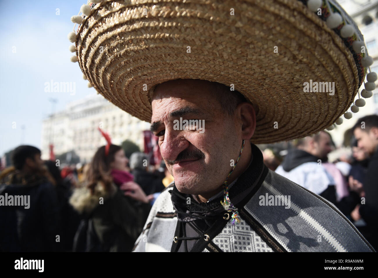 Thessaloniki, Greece. 22nd Dec, 2018. A man wearing a sombrero takes ...