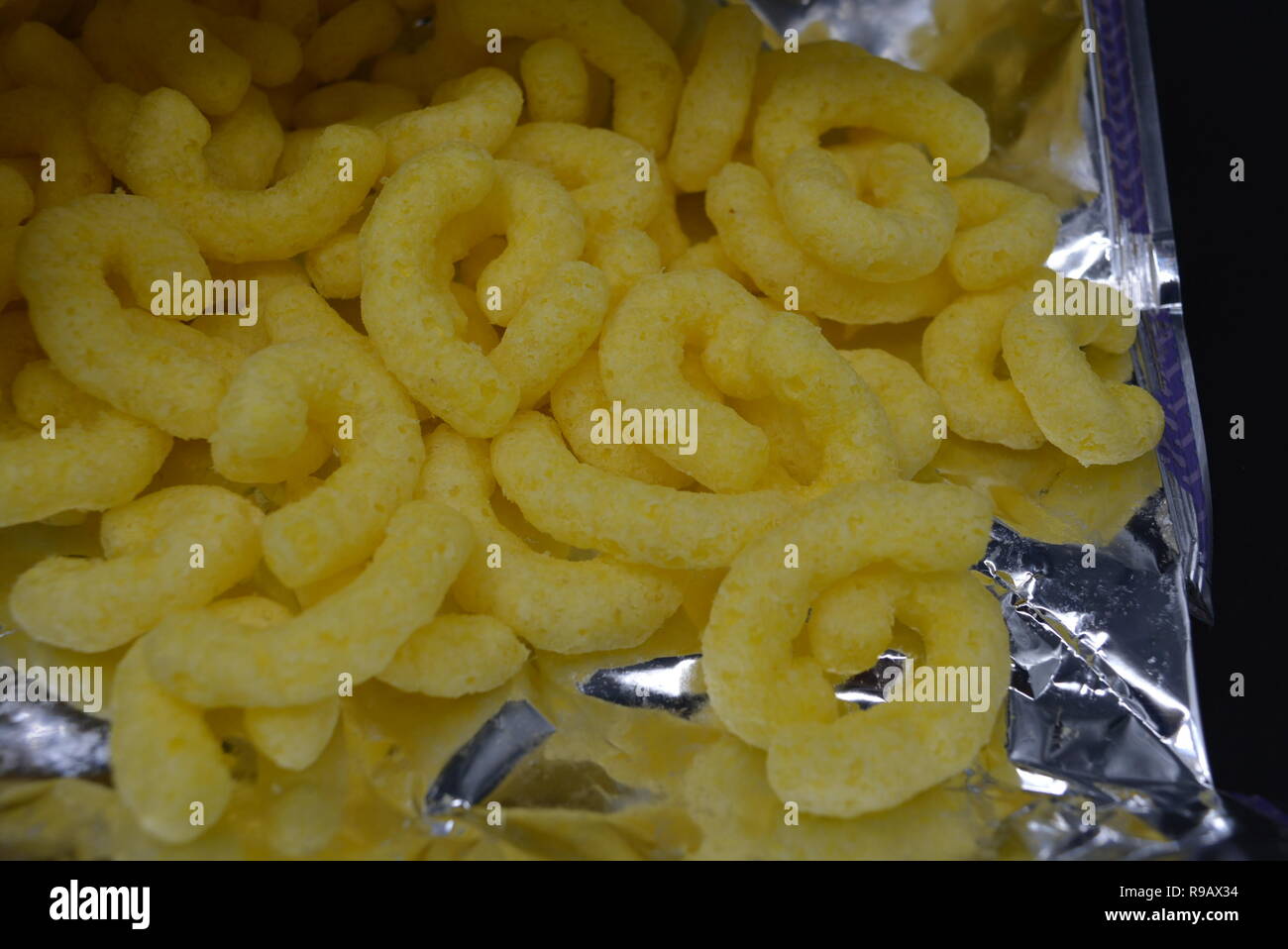 Delicious sweet corn sticks in silver packaging, snack, fast food Stock ...